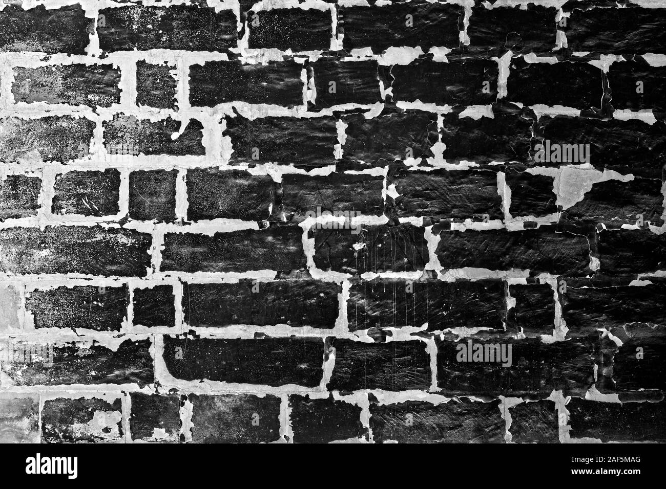 Texture and detail of burnt and flaking plaster on a limestone wall ...