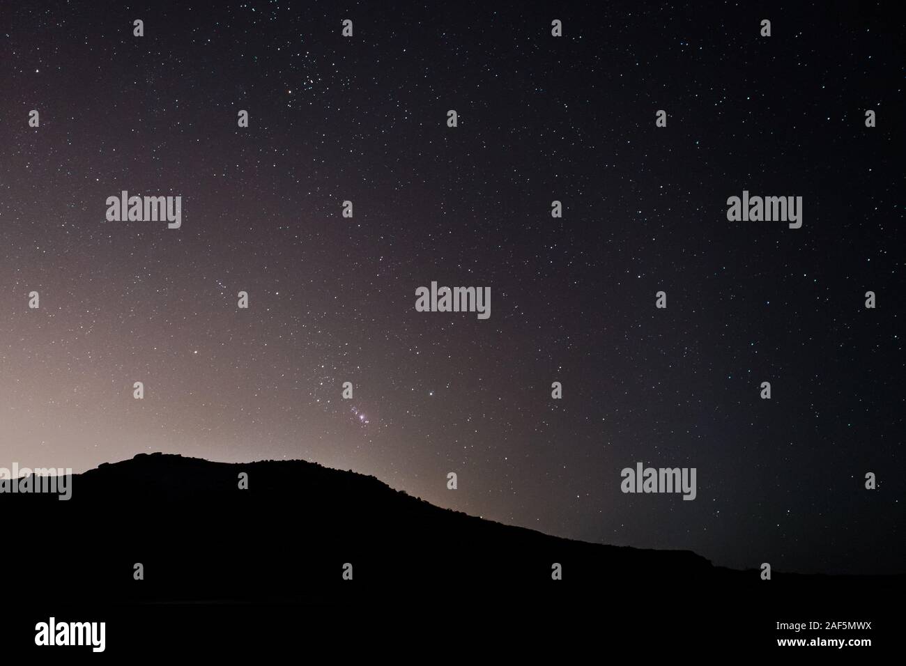 Orion constellation rising over hilltop at Mtahleb Stock Photo - Alamy