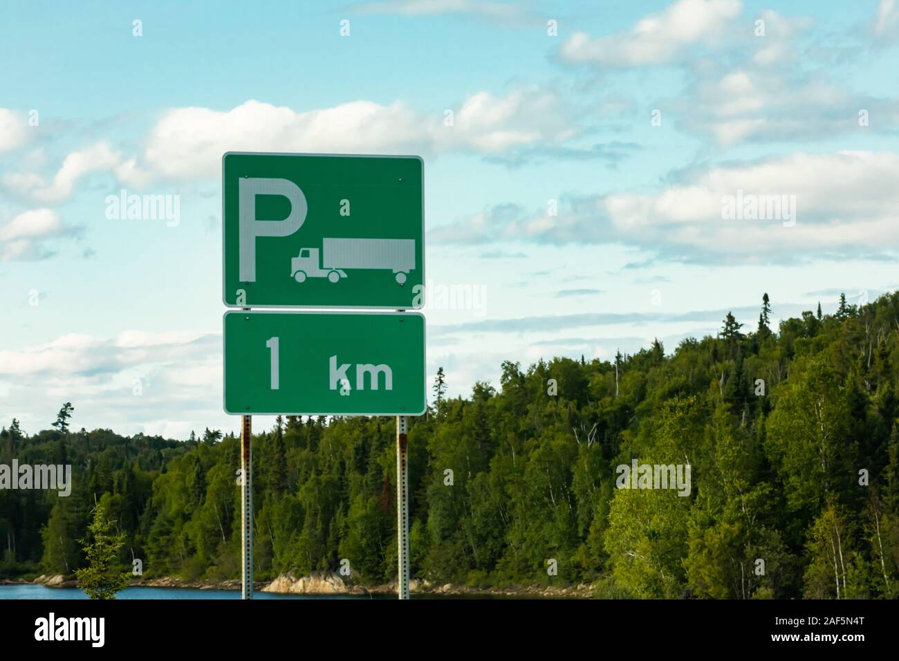 Trucks Parking Green Sign with a white long truck symbol, after 1 km ...