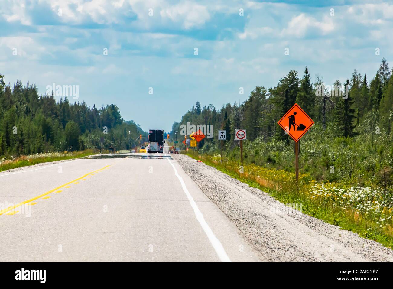 Temporary condition road warning signs on roadside before road work ...