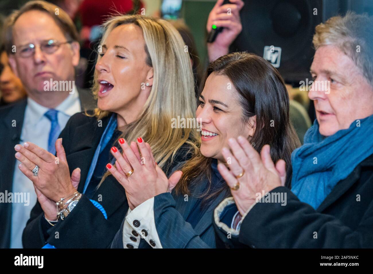 Esher, London, UK. 13th Dec, 2019. His wife and team celebrate ...
