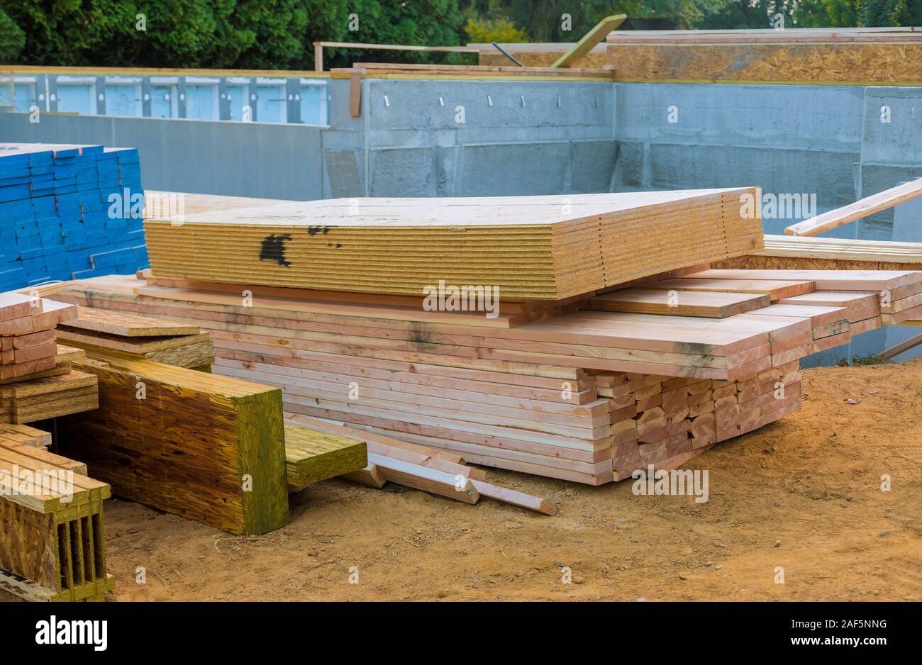 Stacked wooden building materials a stack of boards wood frame beam ...