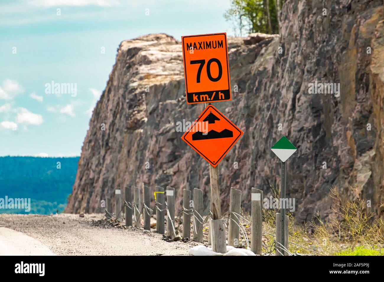 Temporary condition road signs, an orange sign shows the maximum safe ...