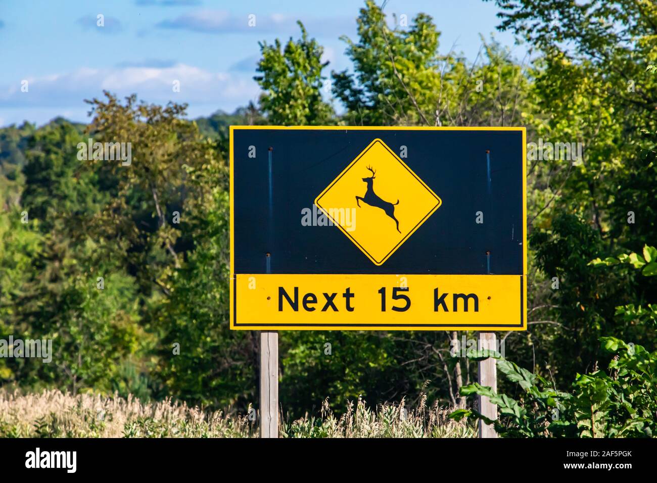Deer regularly cross this road, be alert for animals next 15 km sign ...