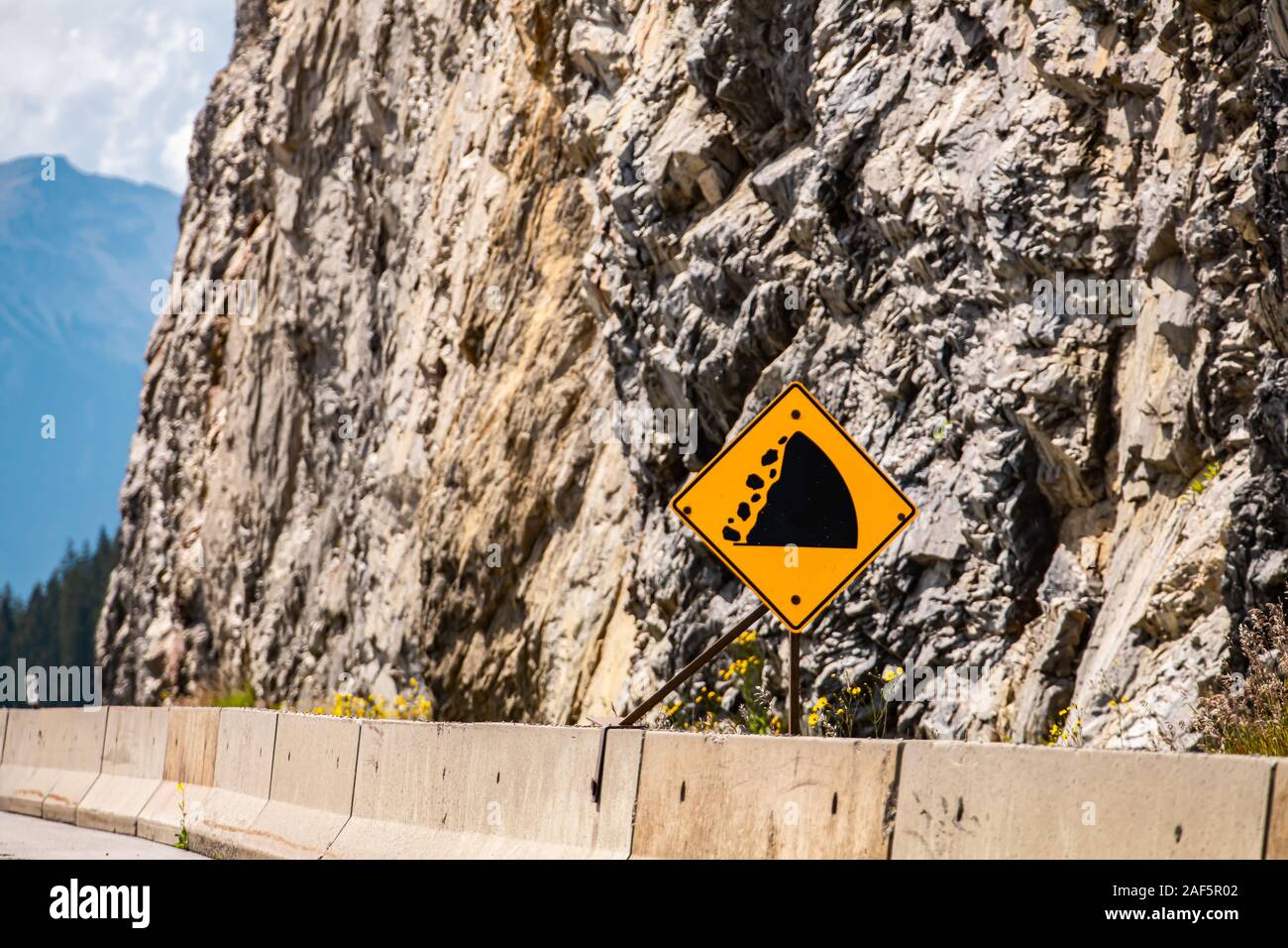 Watch for fallen rock and be prepared to avoid a collision sign ...