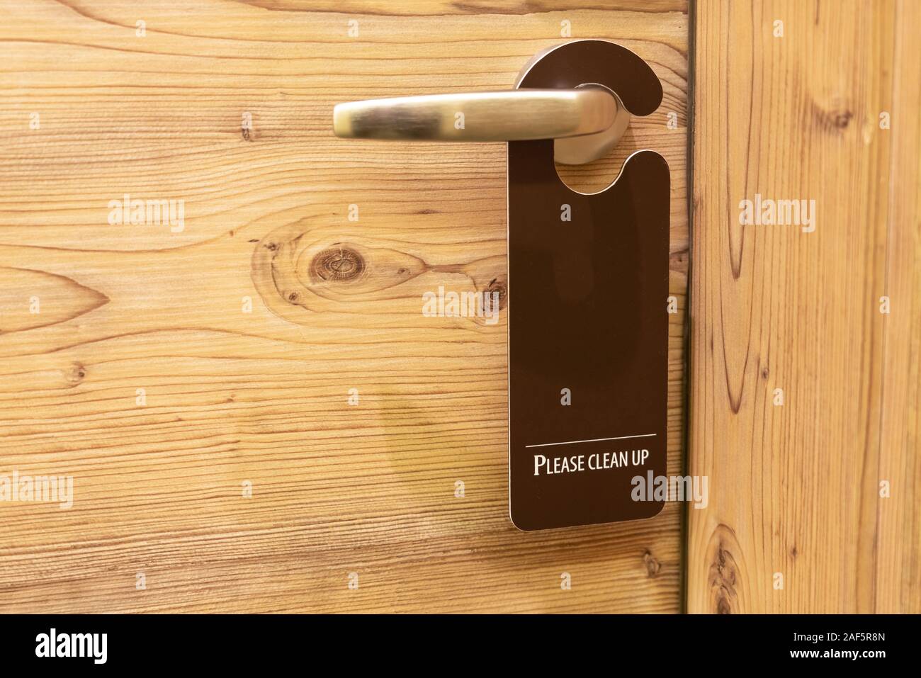 The hotel room with PLEASE MAKE UP ROOM sign on the door Stock Photo ...