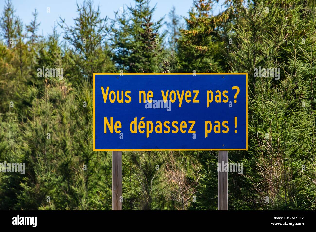 Blue Information Road Sign with french yellow writing, you cannot see ...