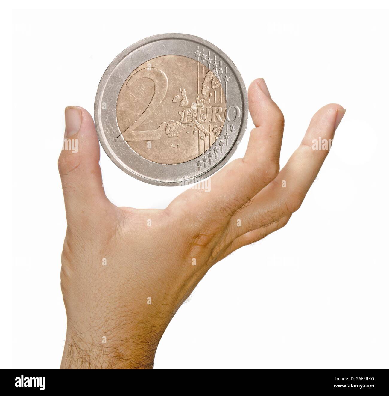 Two euro in hand isolated on white background Stock Photo - Alamy