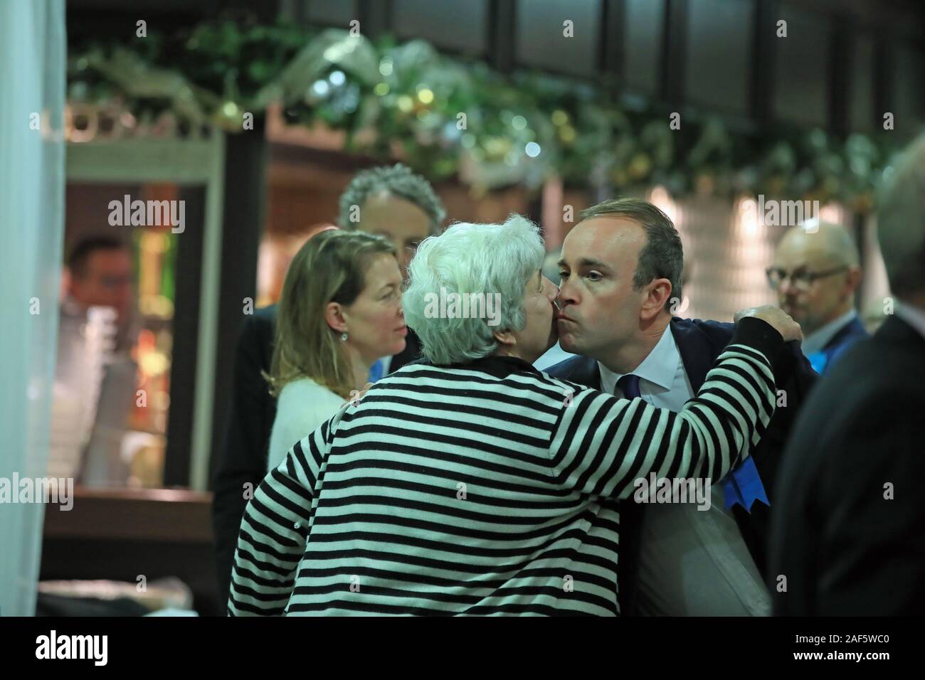 Conservative candidate Aaron Bell embraces his mother as he is declared ...