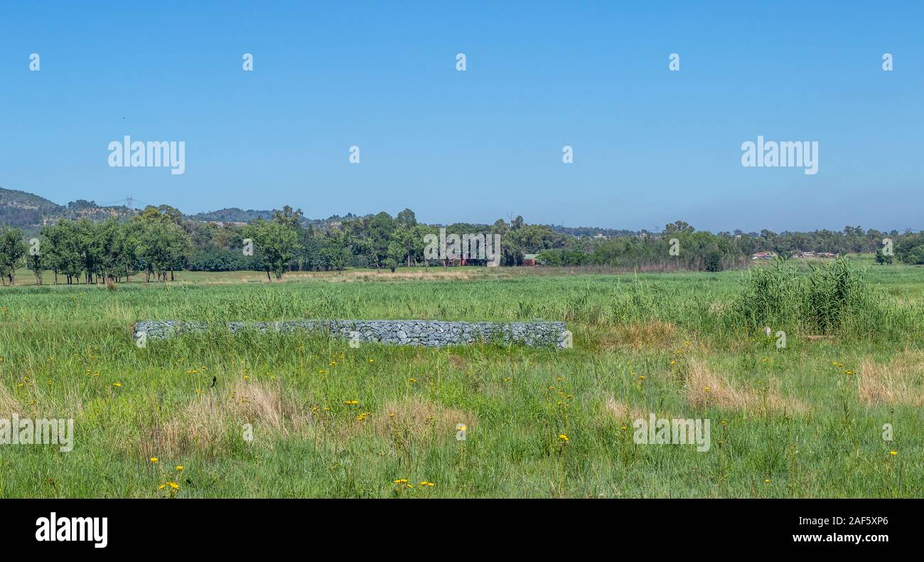 A gabion wall constructed to control flooding in a low lying area of ...