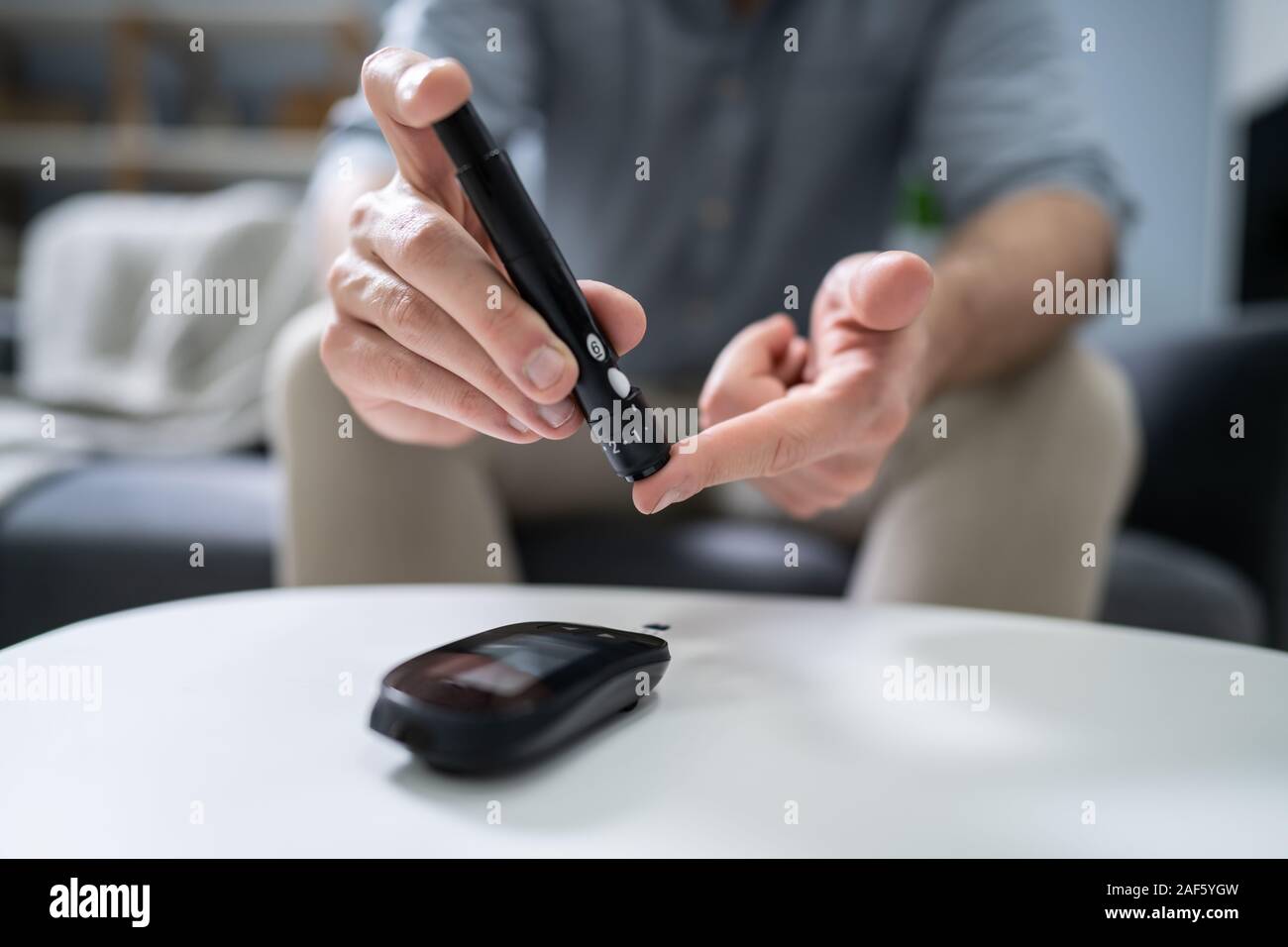 Close-up Of A Man's Hand Testing High Blood Sugar With Glucometer Stock ...