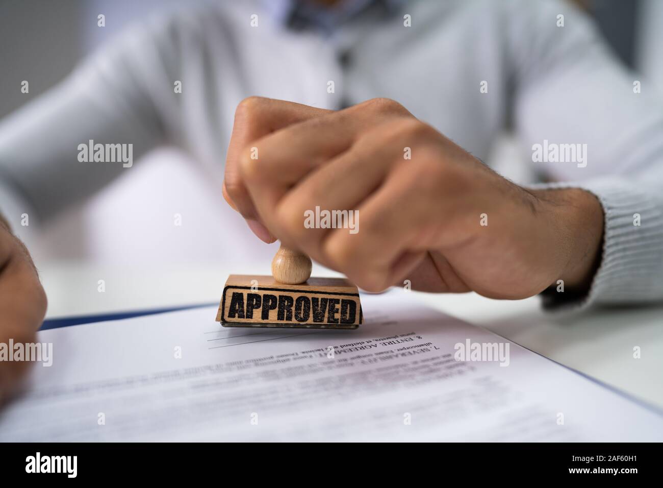Close up persons hand using stamp hi-res stock photography and images ...