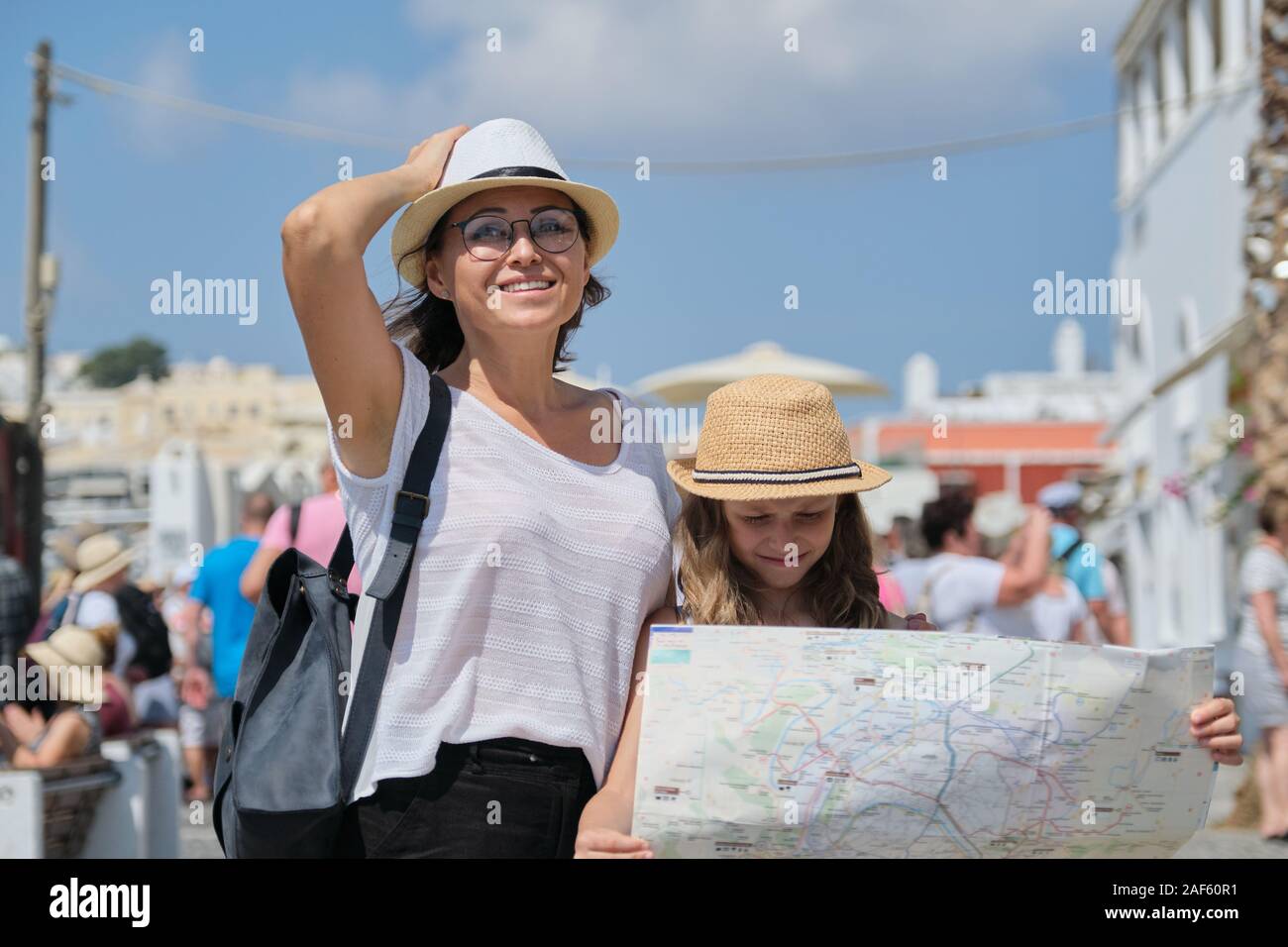 Mother and little child daughter traveling, reading map Stock Photo - Alamy