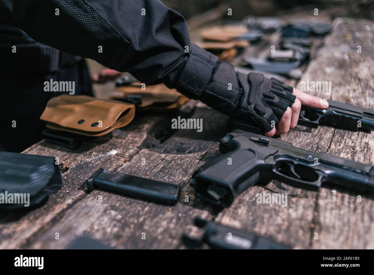 instructor in sport shooting to test your weapons in nature Stock Photo ...