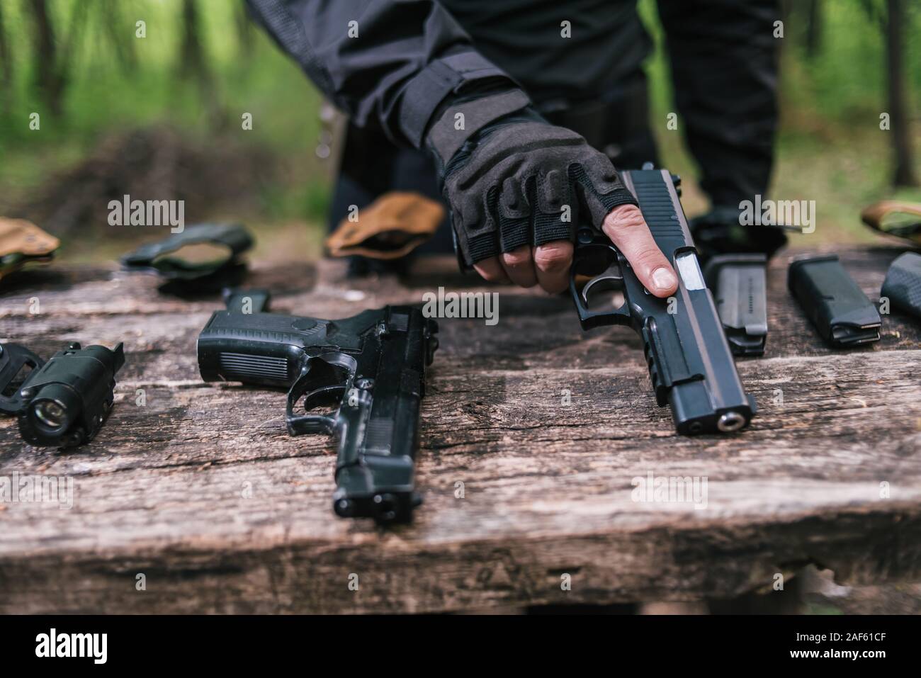 instructor in sport shooting to test your weapons in nature Stock Photo ...