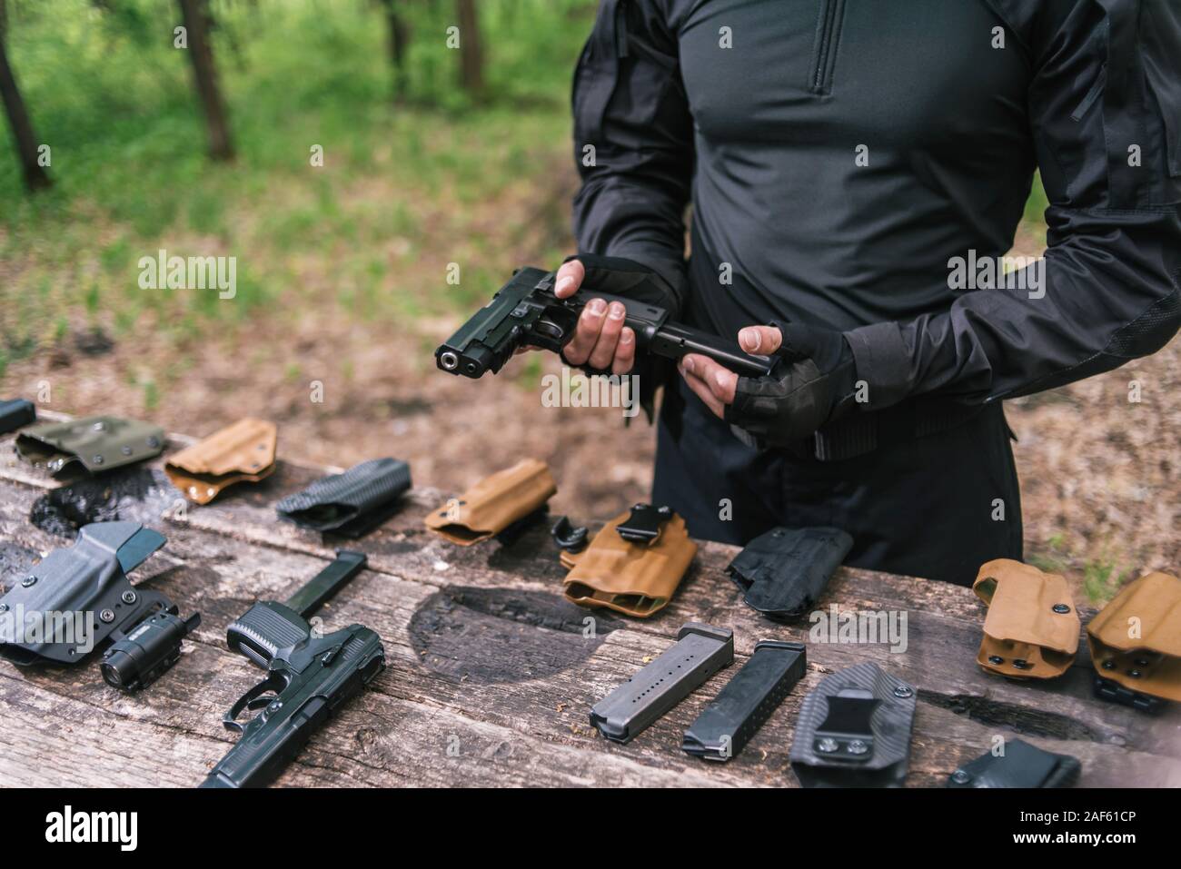 instructor in sport shooting to test your weapons in nature Stock Photo ...