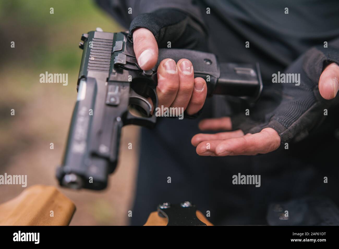 instructor in sport shooting to test your weapons in nature Stock Photo ...
