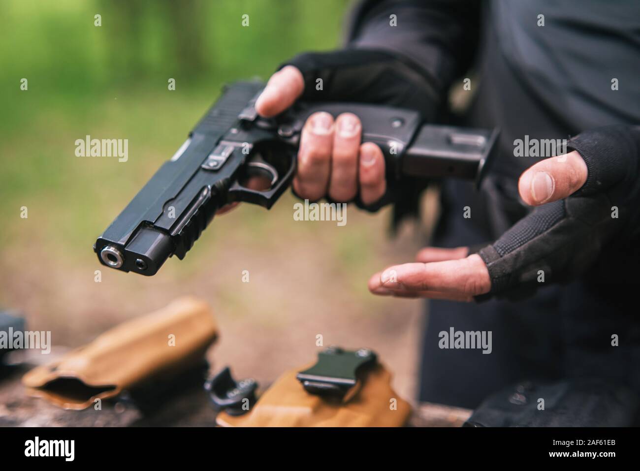 instructor in sport shooting to test your weapons in nature Stock Photo ...