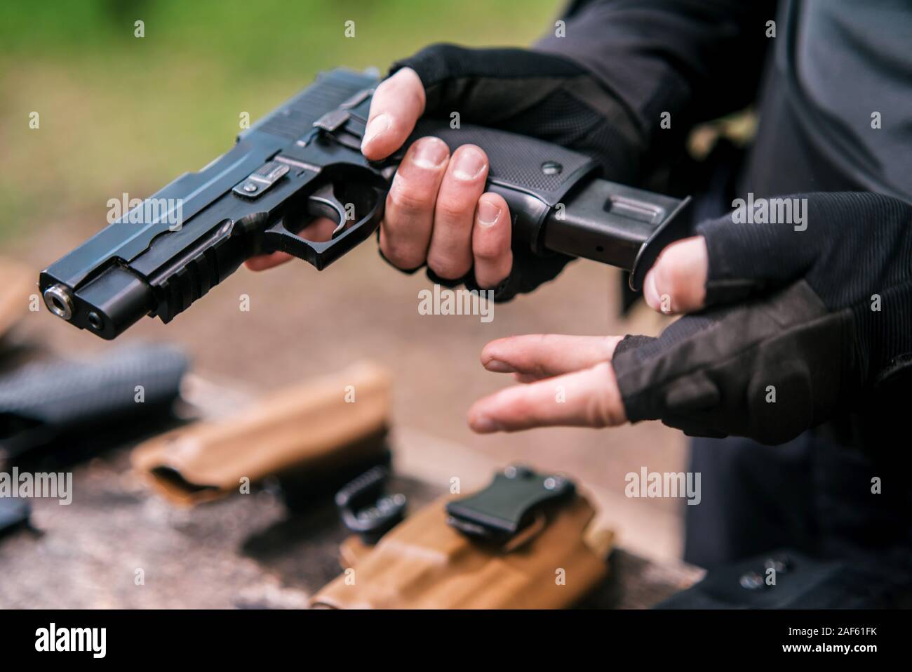 instructor in sport shooting to test your weapons in nature Stock Photo ...