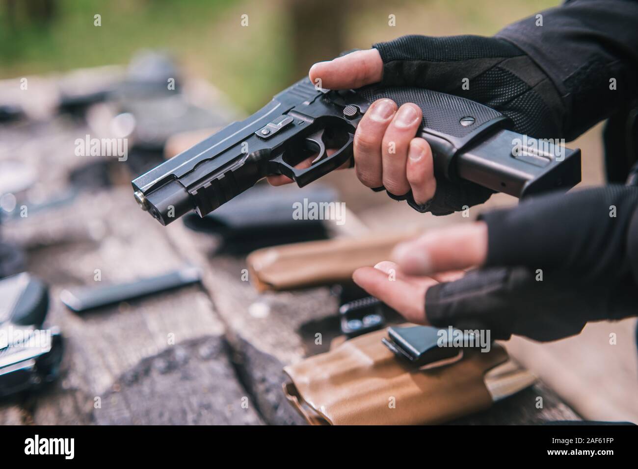 instructor in sport shooting to test your weapons in nature Stock Photo ...
