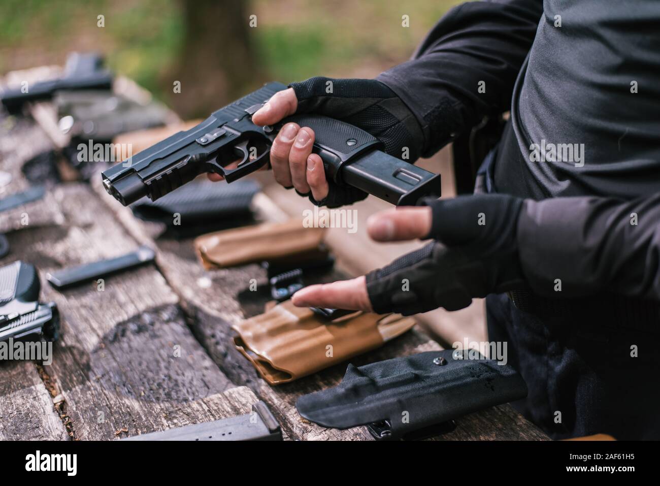 instructor in sport shooting to test your weapons in nature Stock Photo ...
