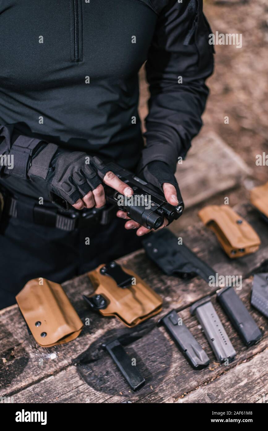 instructor in sport shooting to test your weapons in nature Stock Photo ...