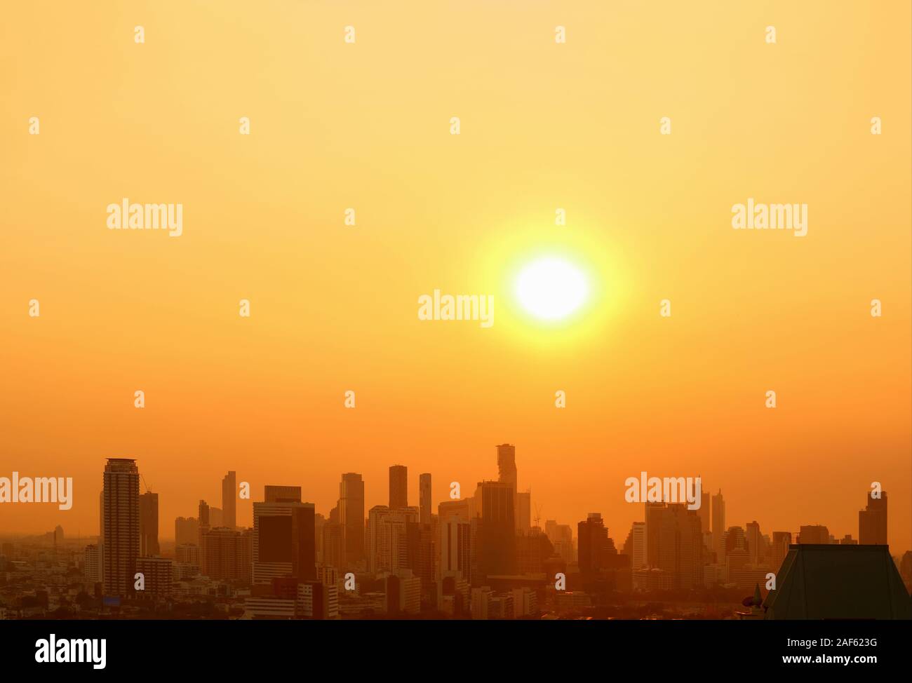 The bright sun rising over the city with copy space Stock Photo - Alamy