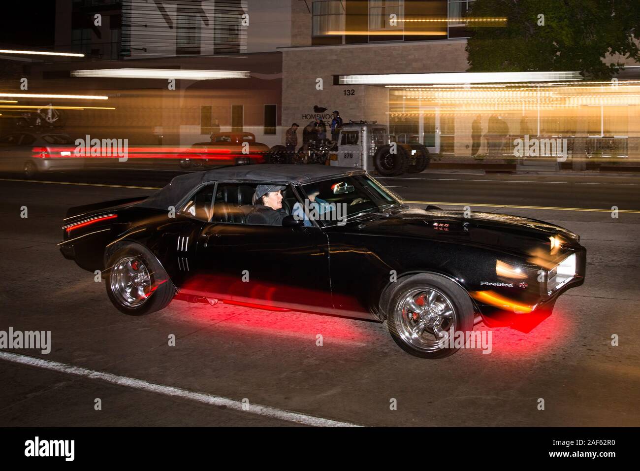 A restored 1968 Pontiac Firebird 400 convertible cruising in the Moab ...