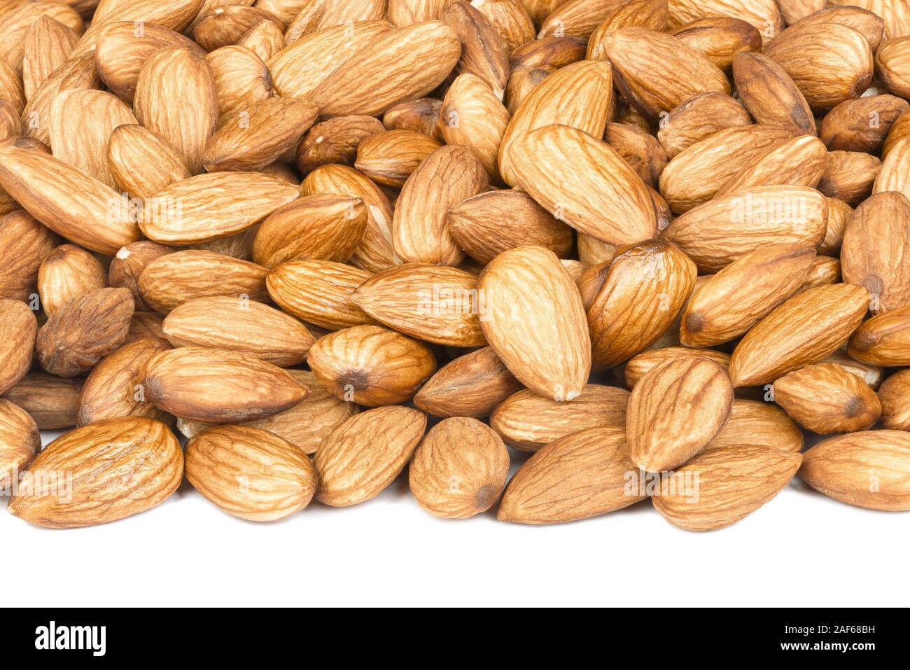 Composition from almond nuts isolated on white background Stock Photo ...
