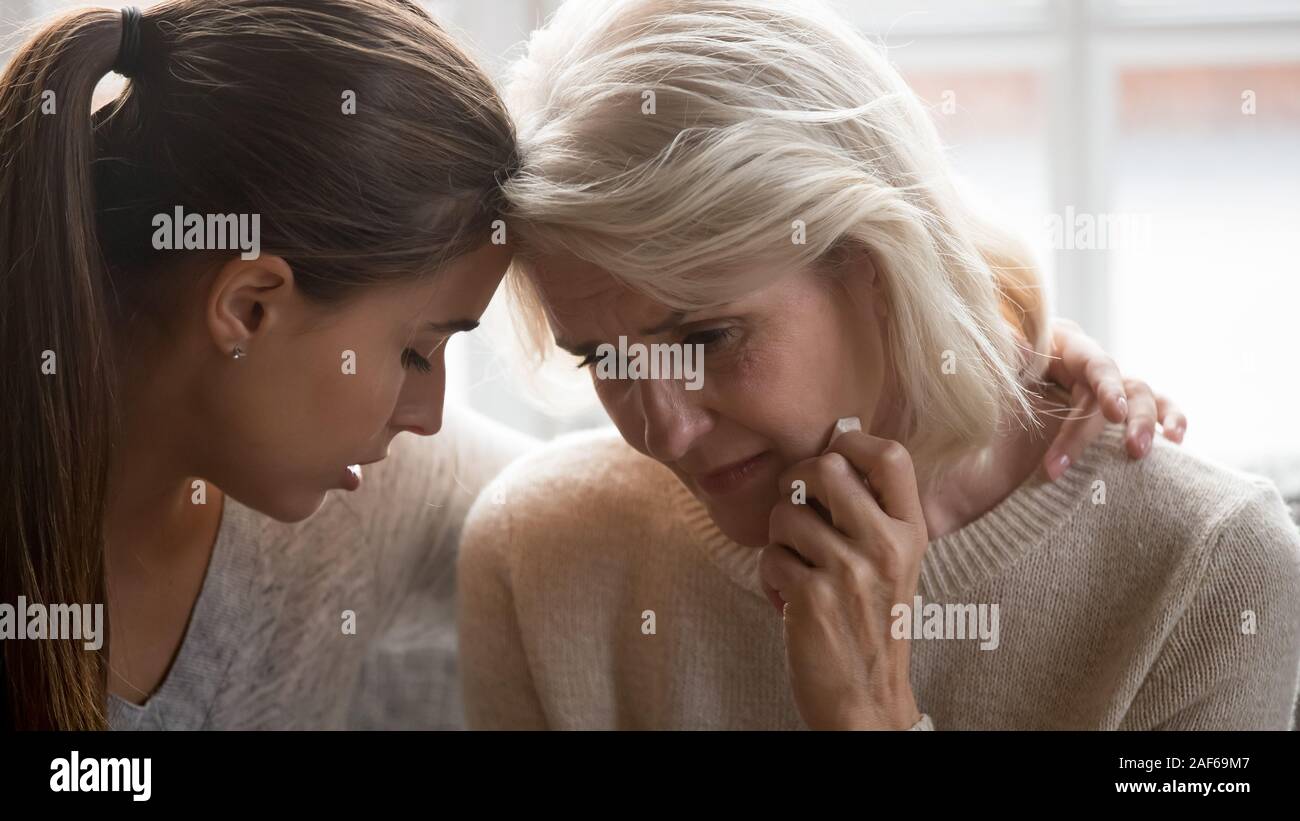 Mother daughter hug crying hi-res stock photography and images - Alamy
