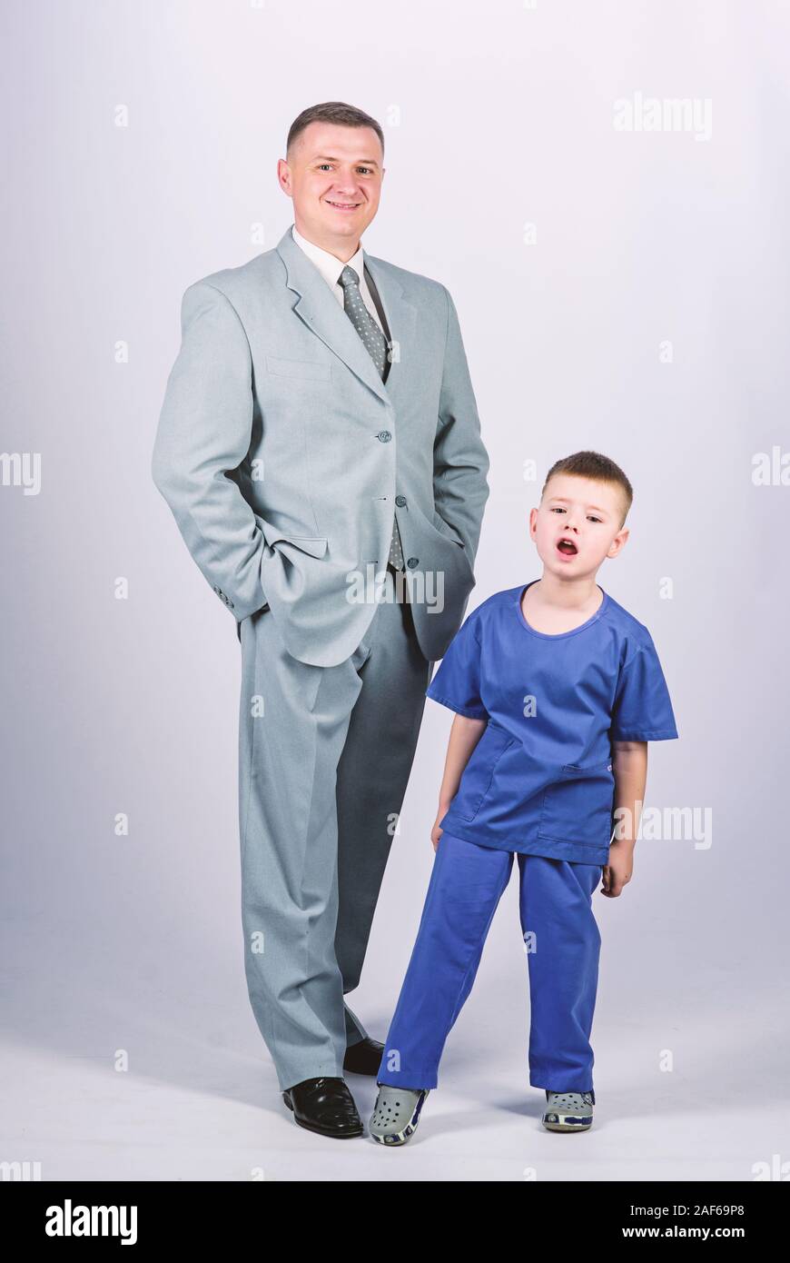 Doctor respectable career. Dad boss. Father and cute small son. Child ...