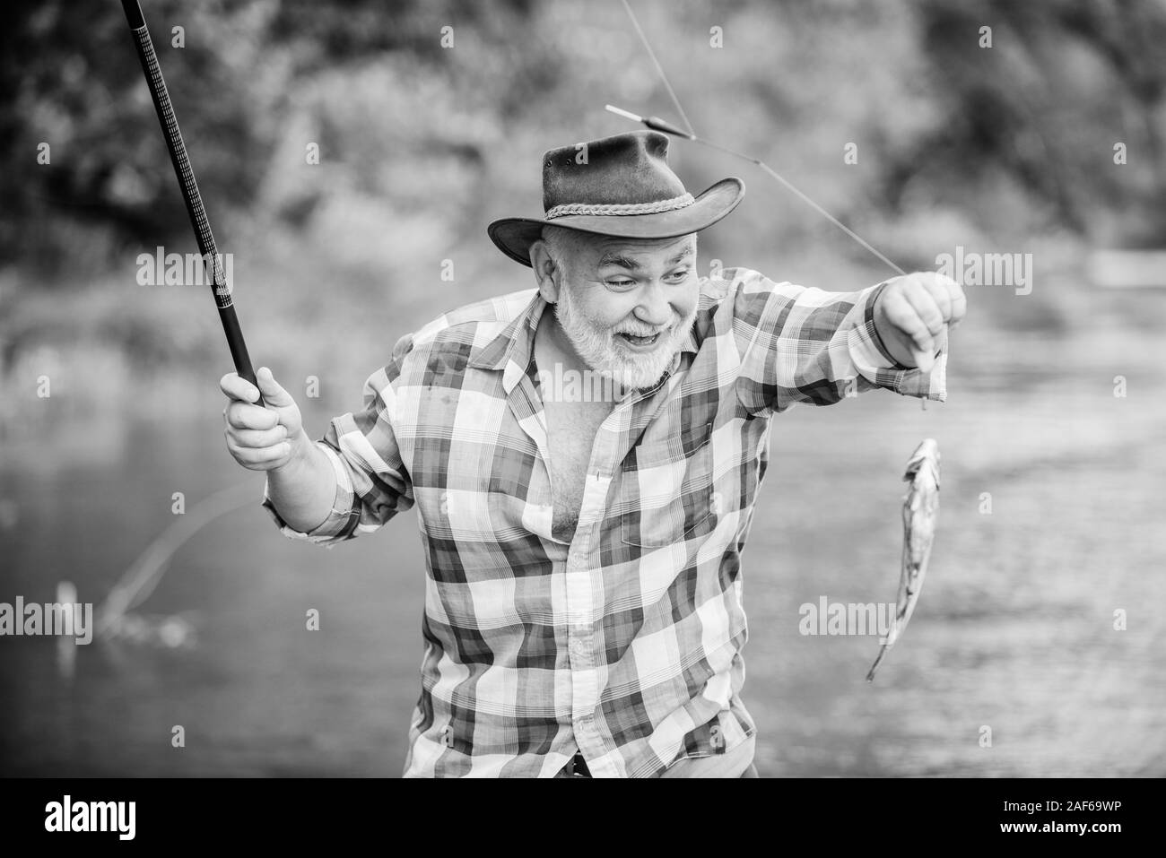 Old man fish farming Black and White Stock Photos & Images - Alamy