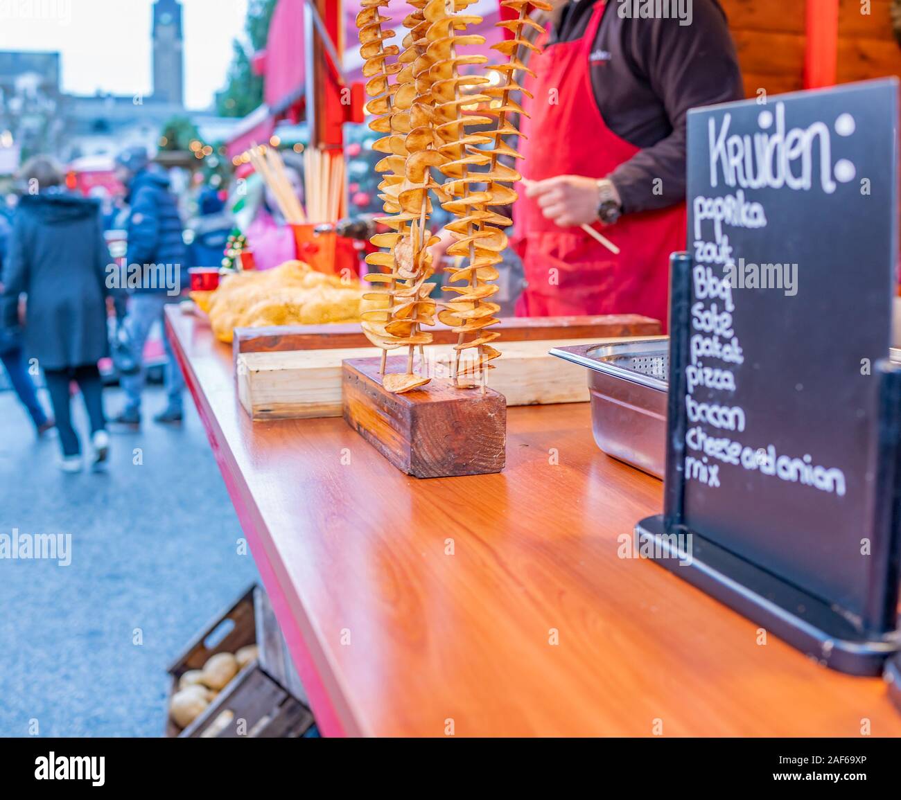 Selective focus on fried crisps on skewers at the 2019 Christmas market ...