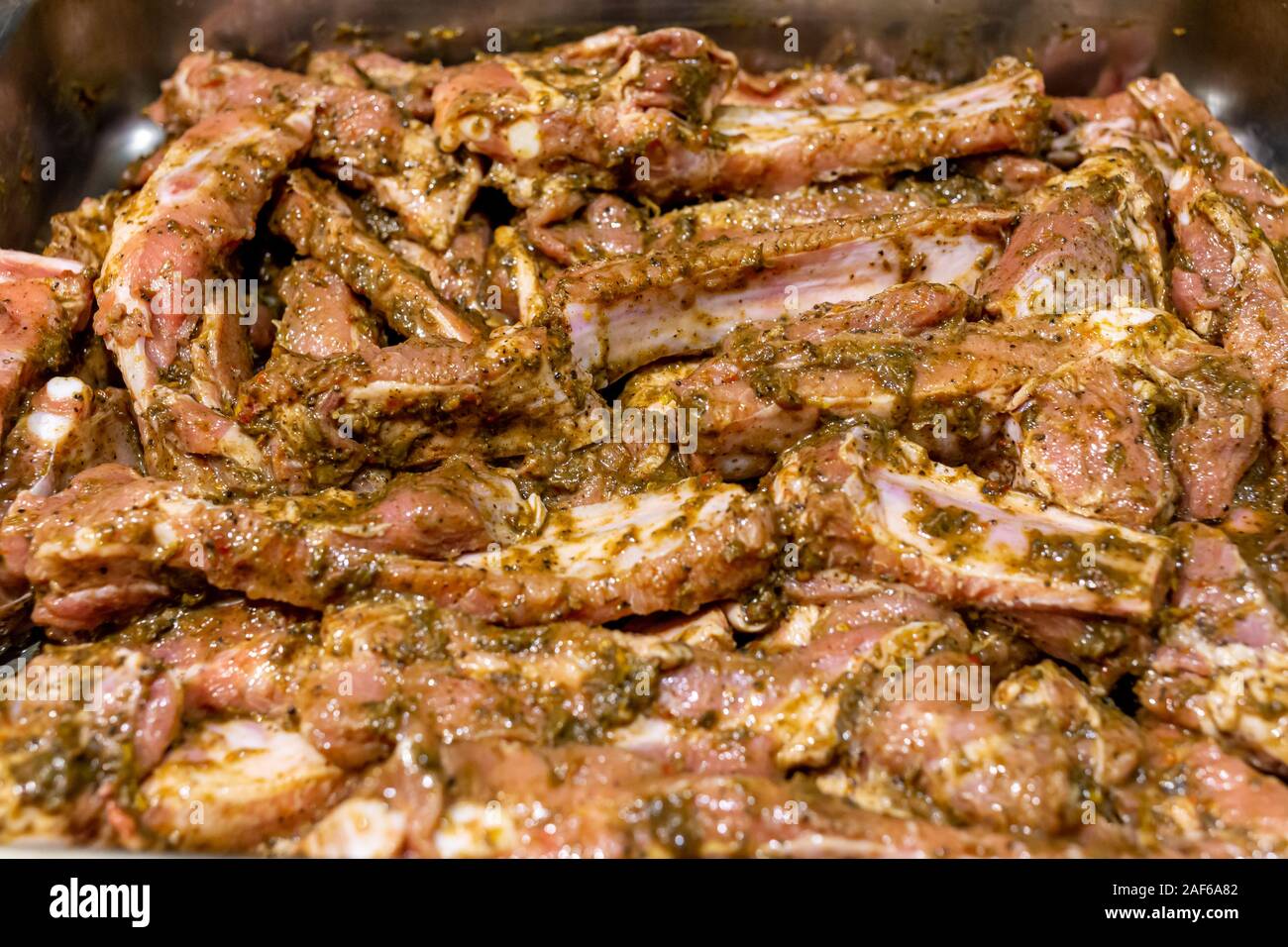 Raw pork ribs marinated in jamaican jerk seasoning Stock Photo - Alamy