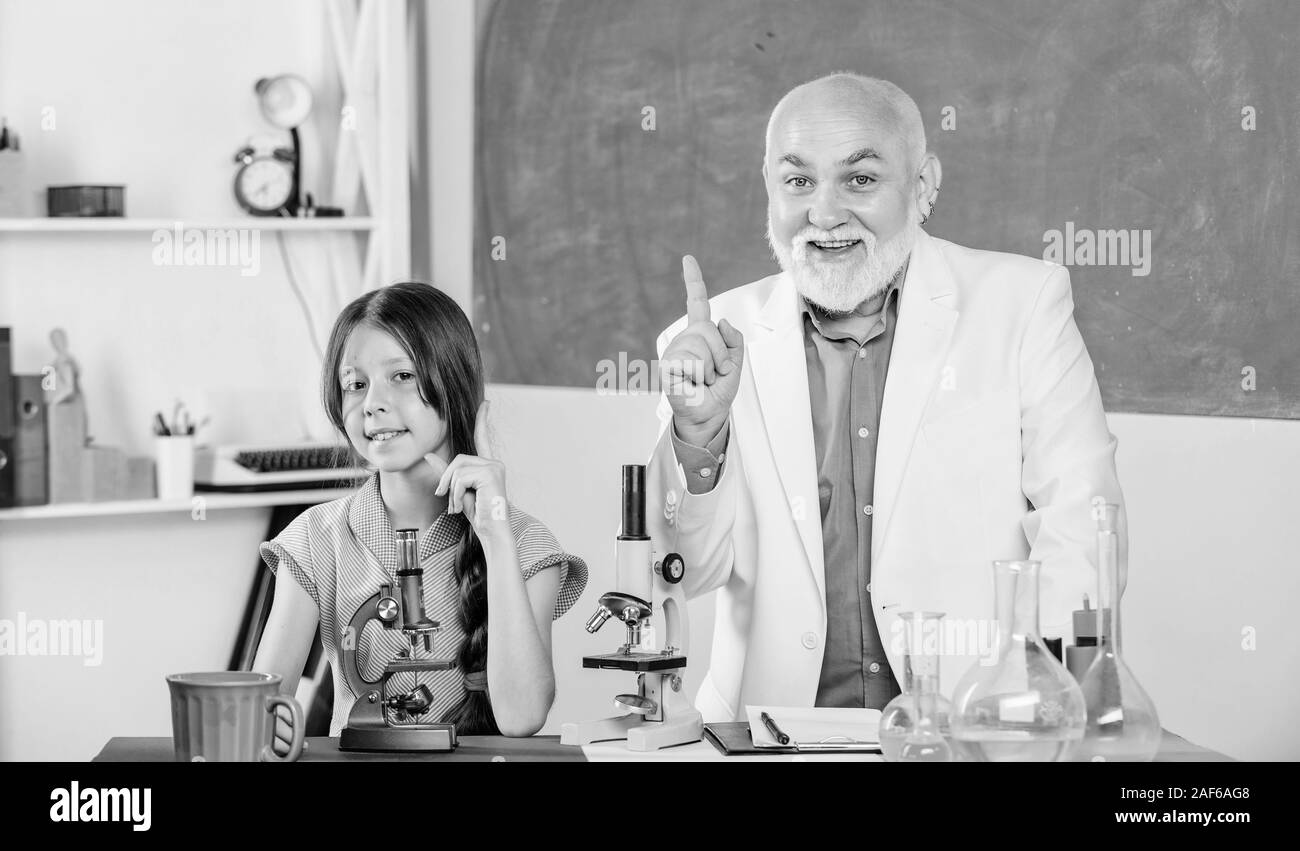 Experienced pedagogue. Chemistry and biology. Little girl with man ...