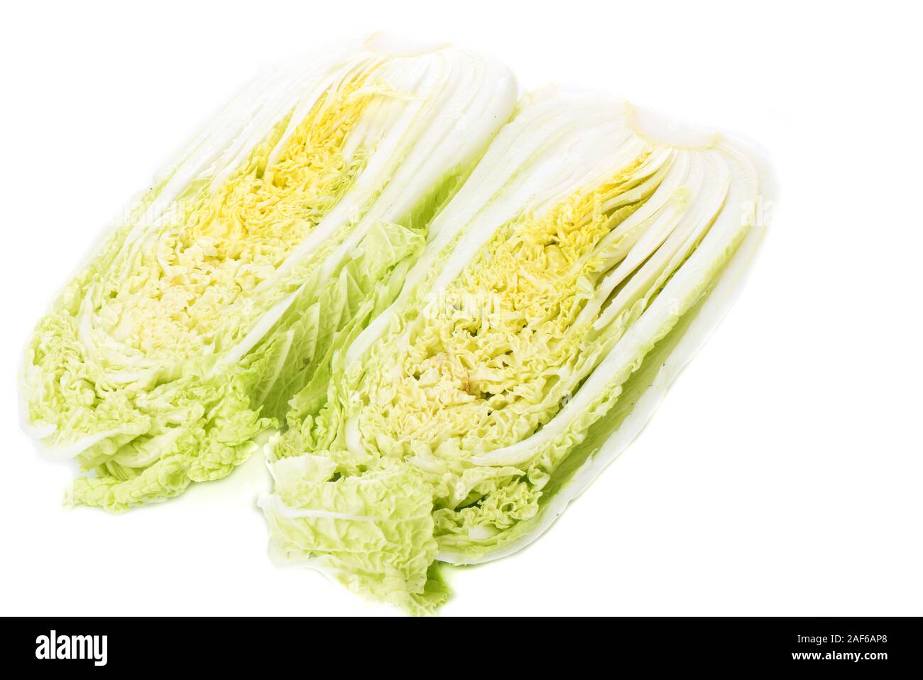 Halved Chinese cabbage or petsai isolated on a white background. Copy ...