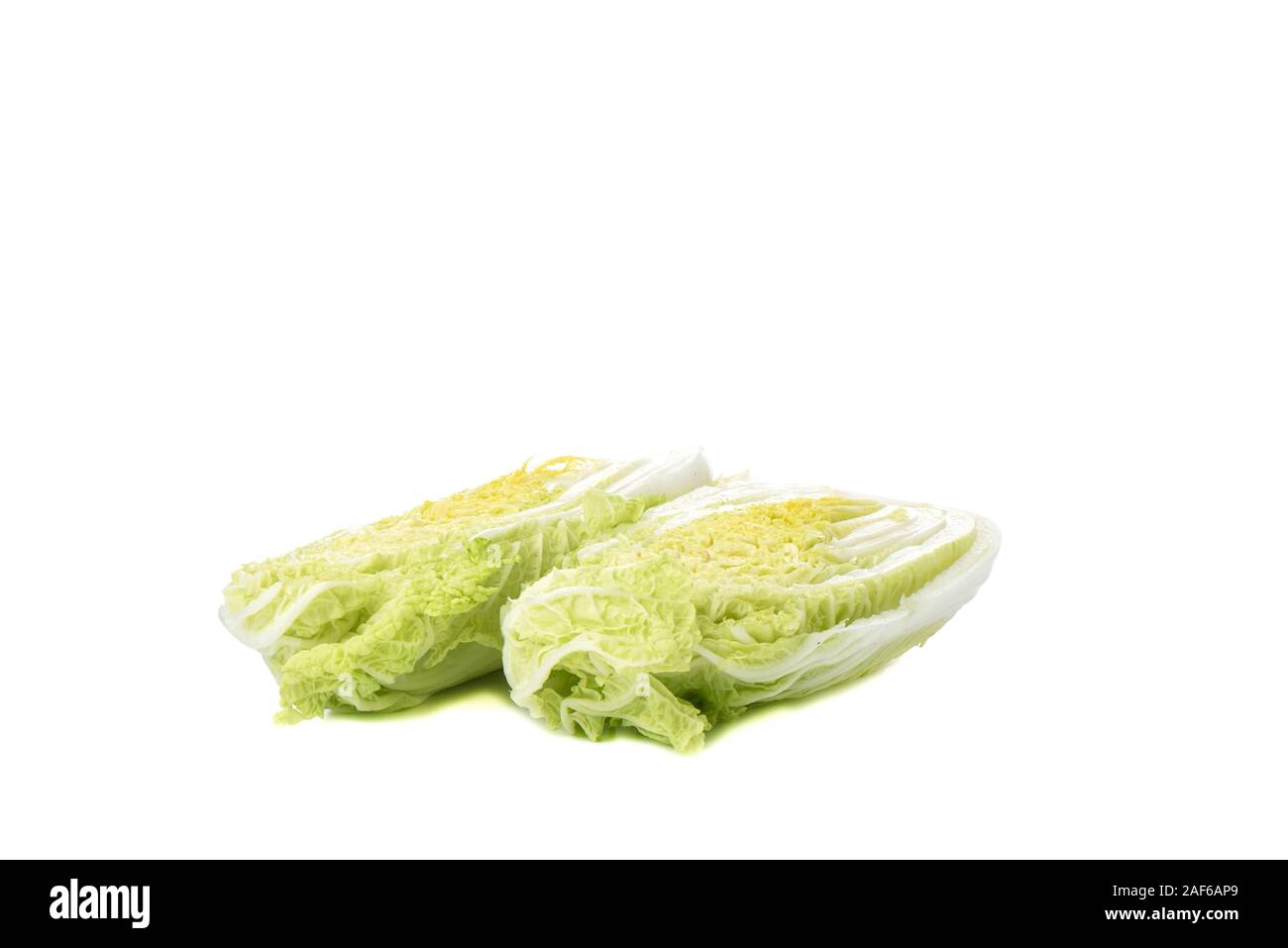 Halved Chinese cabbage or petsai isolated on a white background. Copy ...