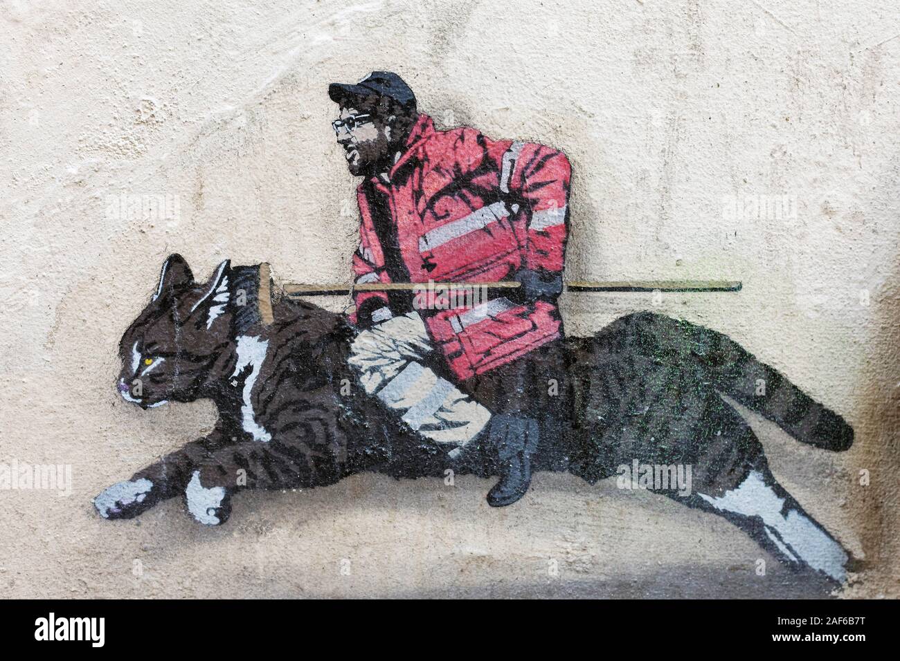 Street sweeper with broom riding on a cat figure, city cleaning ...