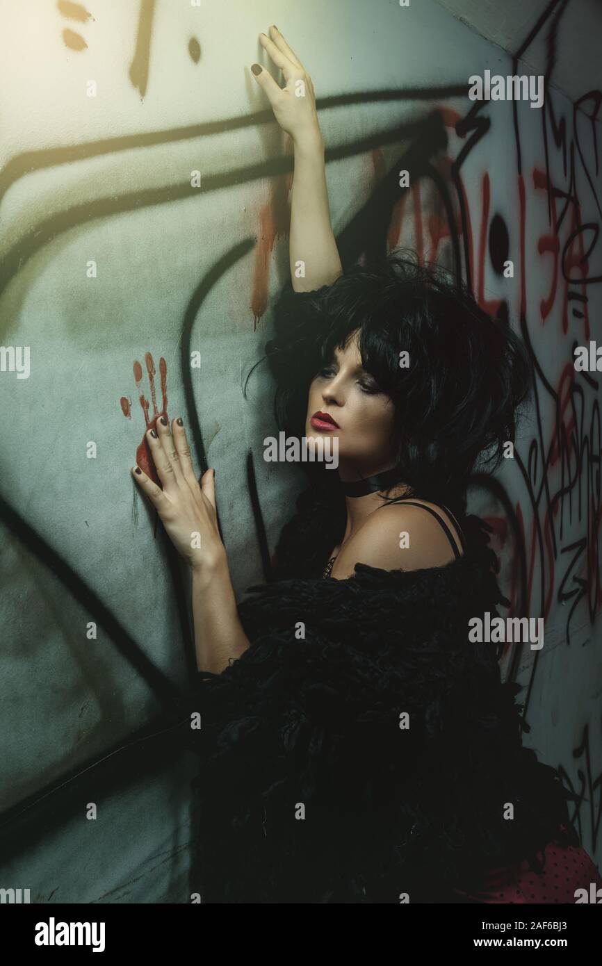 Strange and freaky woman in dark tunnel Stock Photo - Alamy