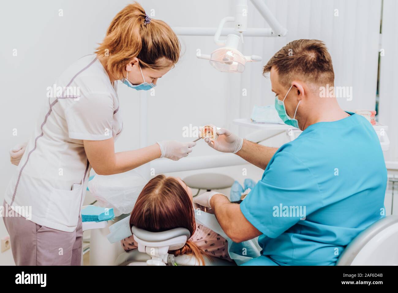 the doctor explains to the patient how he will treat her Stock Photo ...