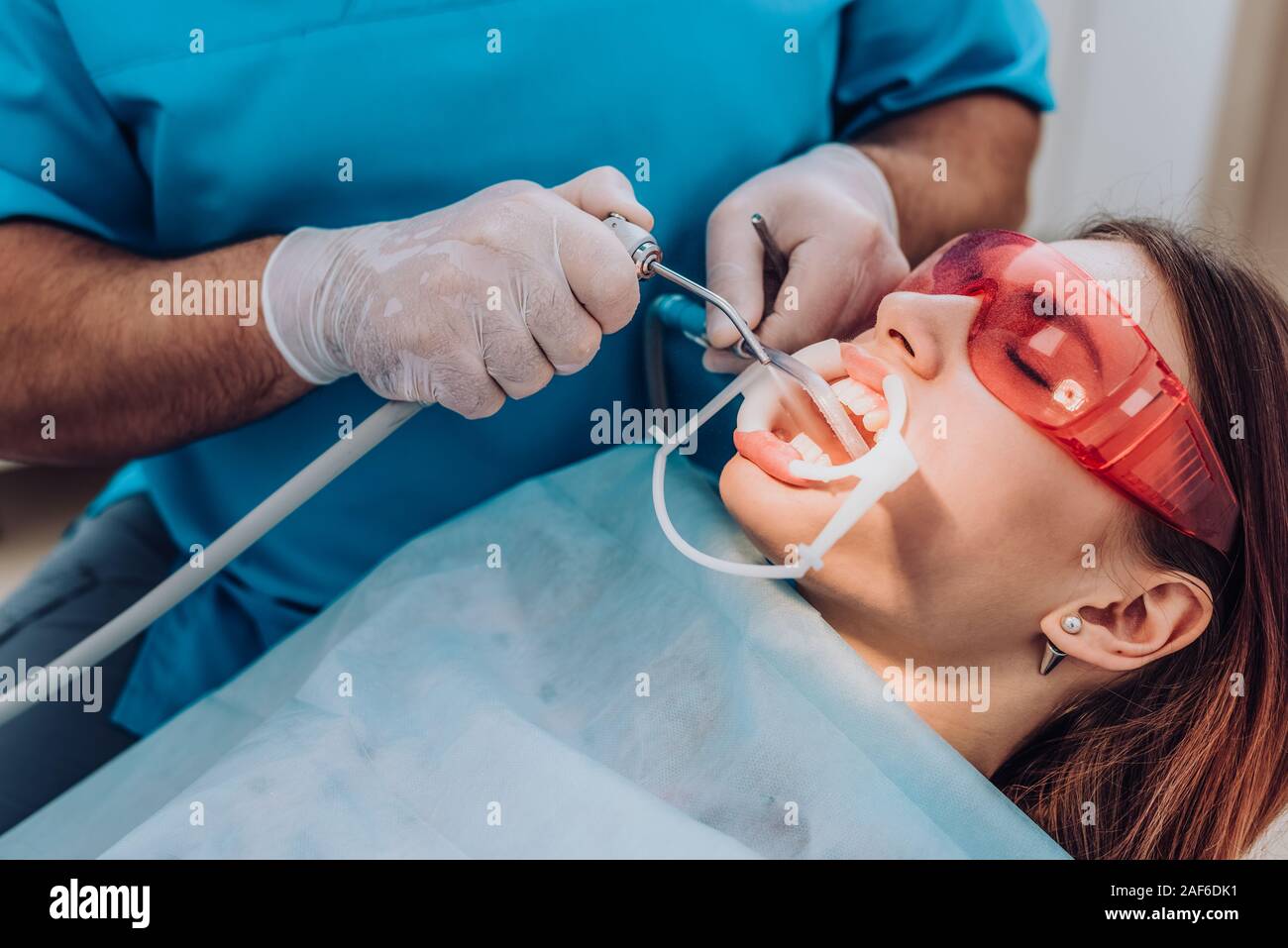doctor performs the procedure for cleaning teeth Stock Photo - Alamy