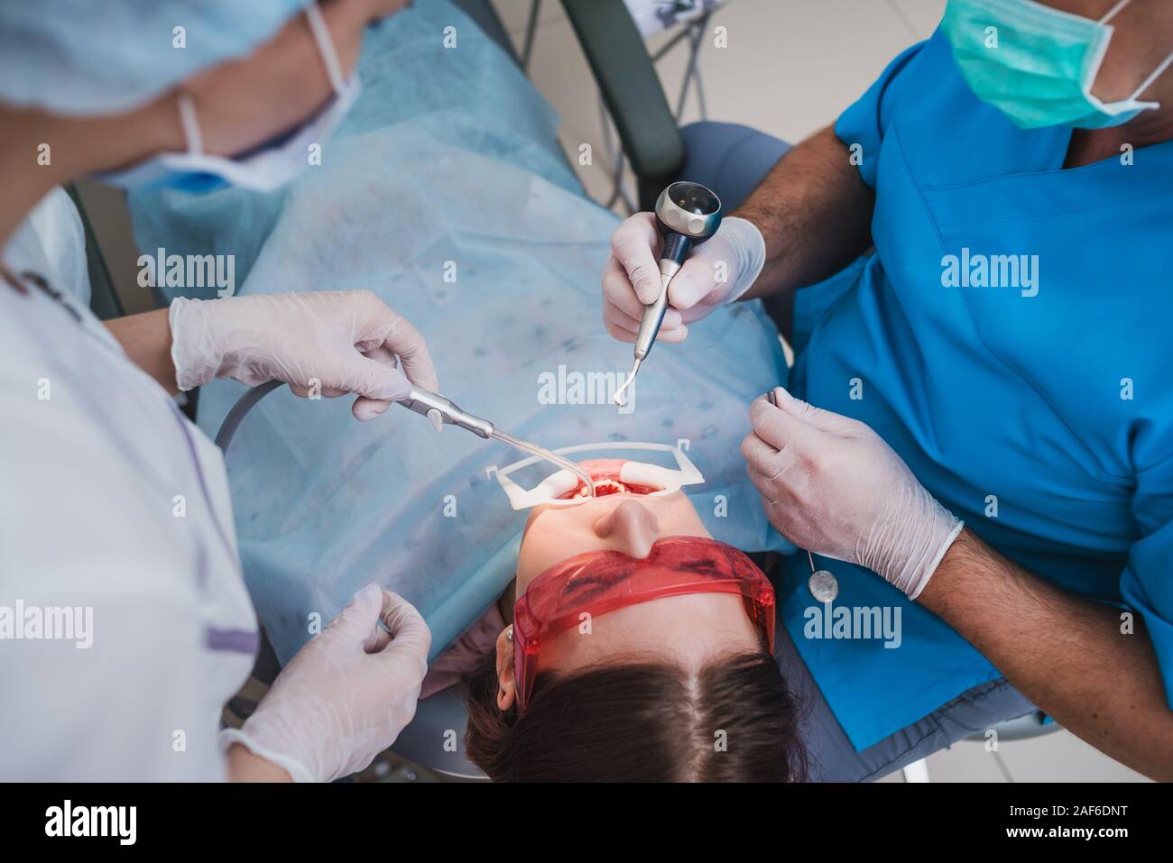 doctor performs the procedure for cleaning teeth Stock Photo - Alamy