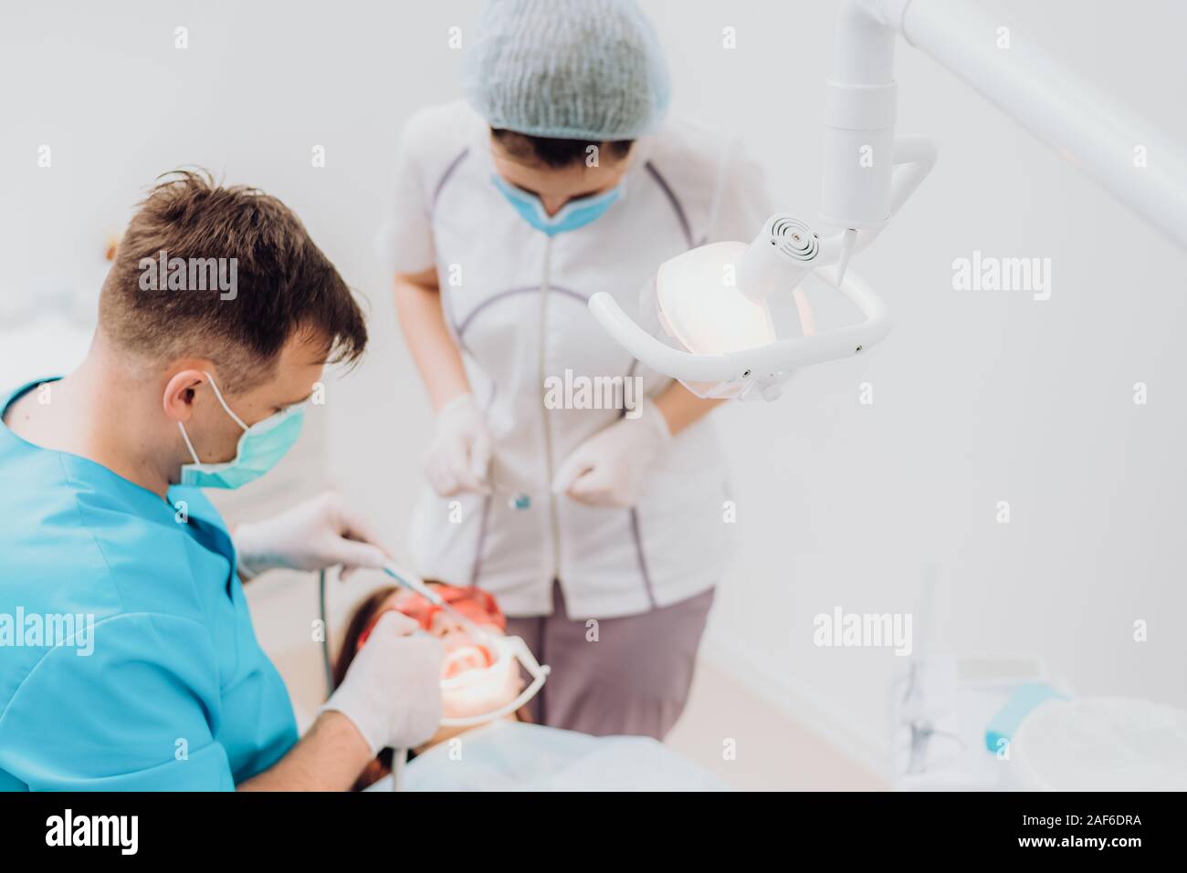 doctor performs the procedure for cleaning teeth Stock Photo - Alamy