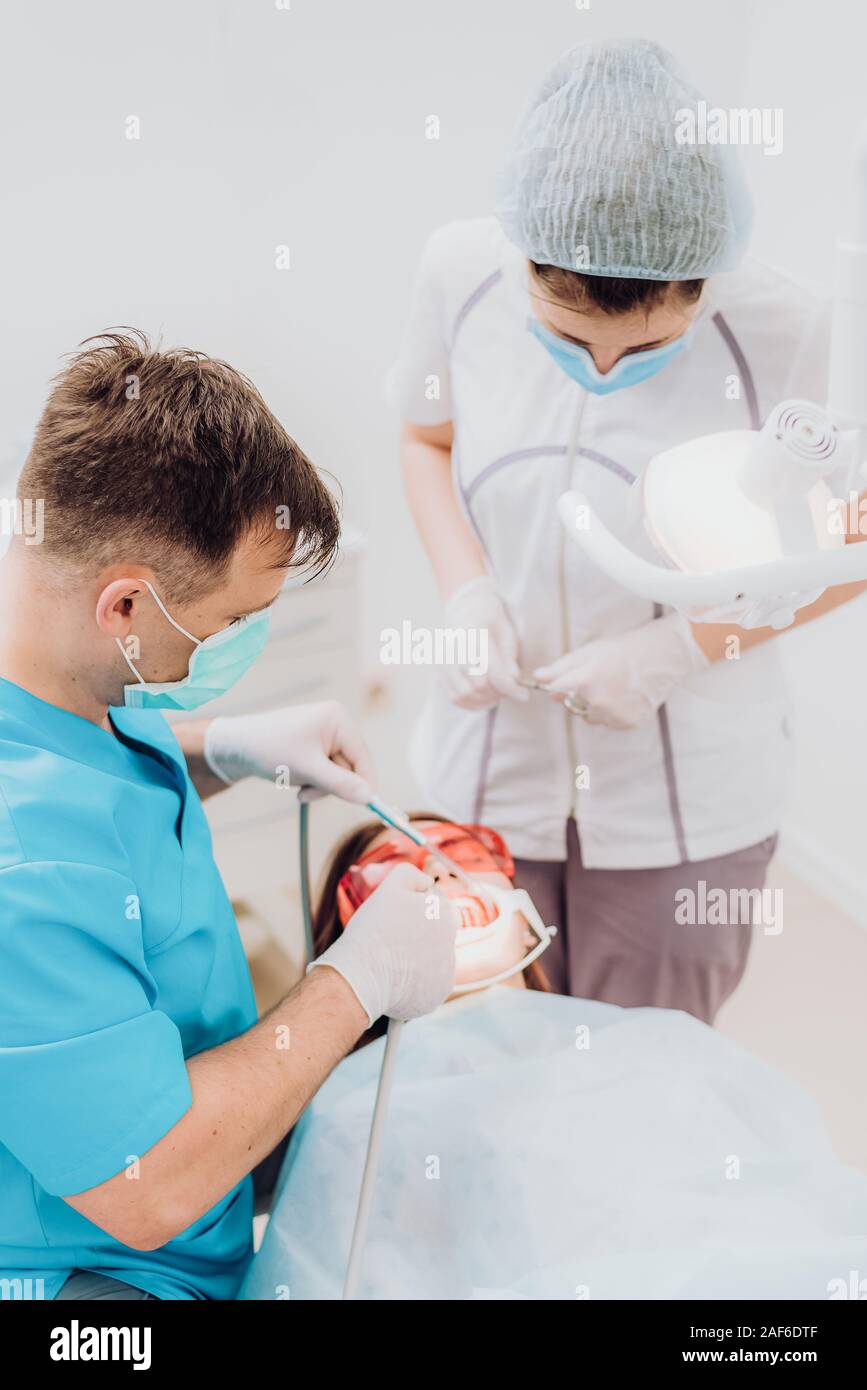 doctor performs the procedure for cleaning teeth Stock Photo - Alamy