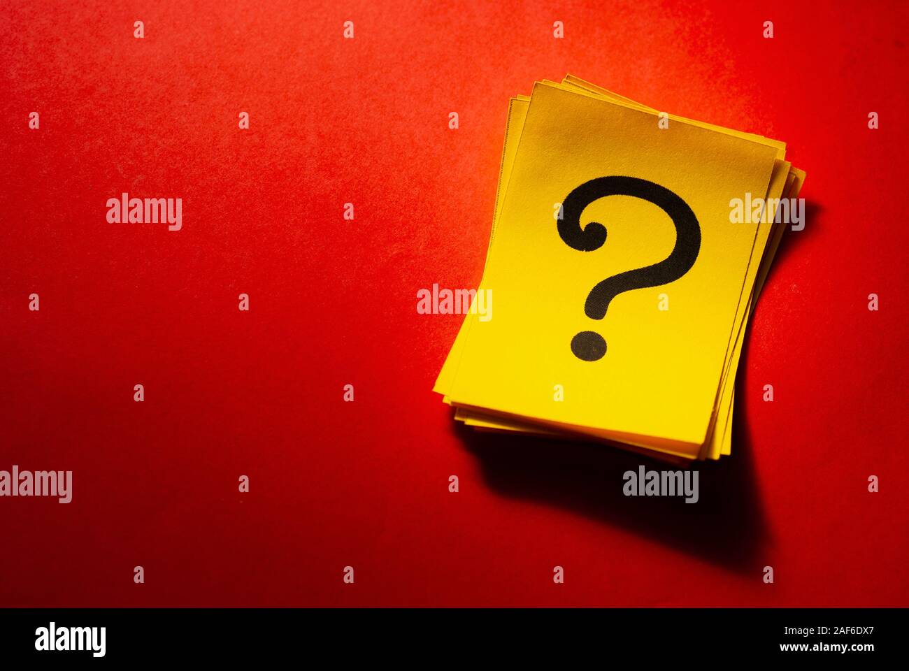Stack of bright yellow cards with question marks Stock Photo - Alamy