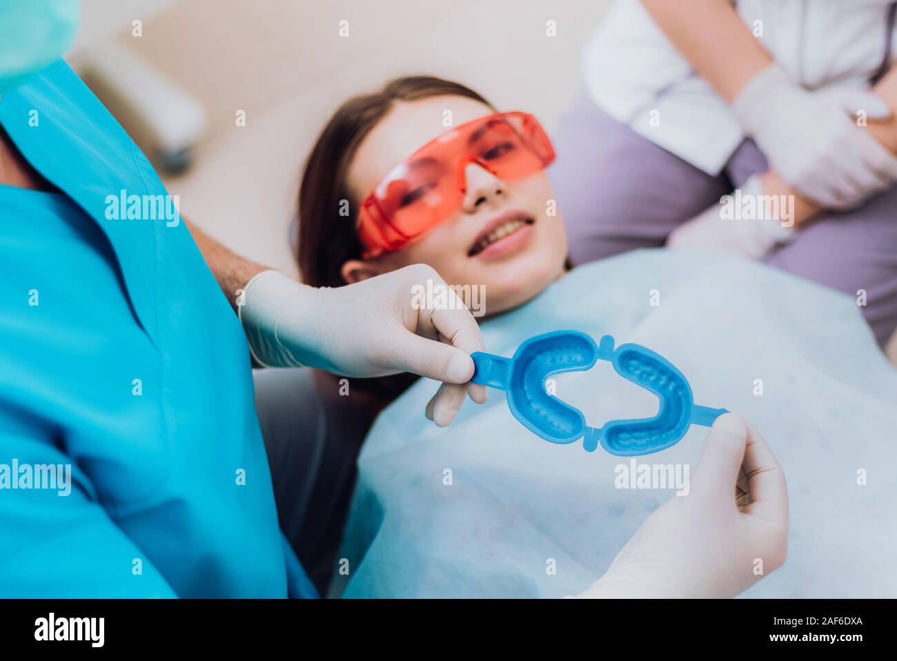 doctor performs the procedure for cleaning teeth Stock Photo - Alamy