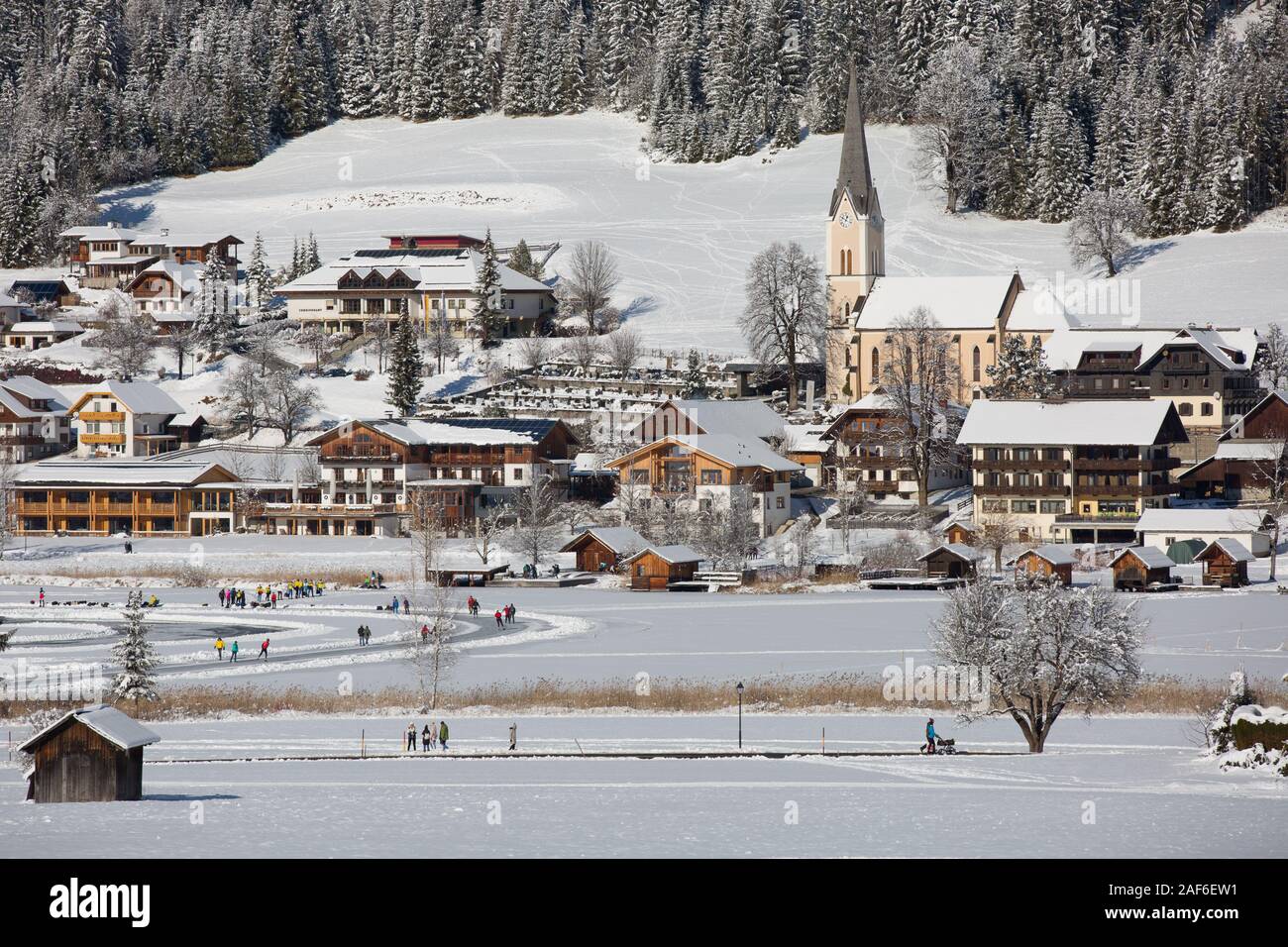 The beautiful setting of the Weissensee Nature Park. Tourists and local ...
