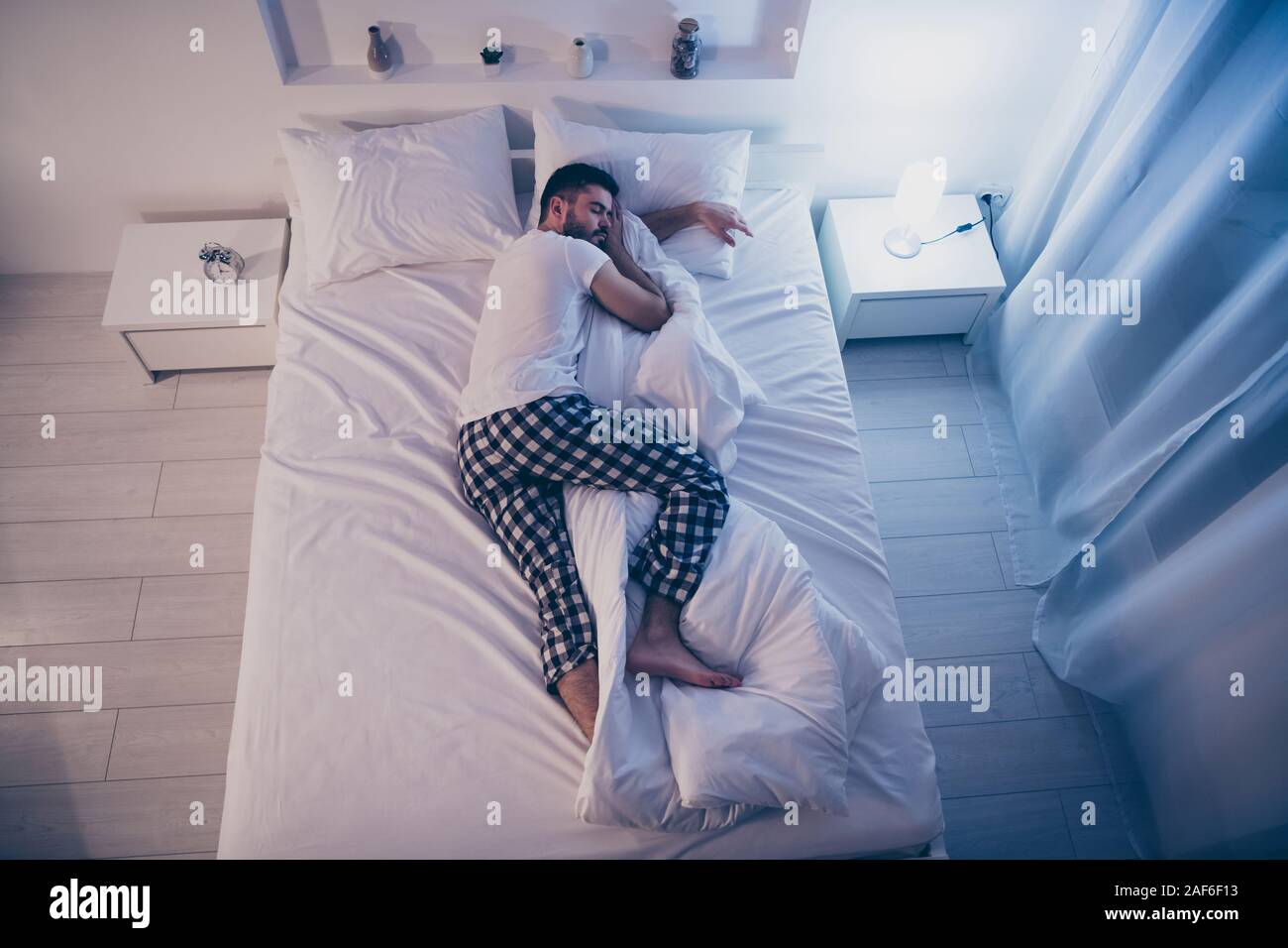 Top above high angle view of his he nice attractive sleepy guy lying on ...