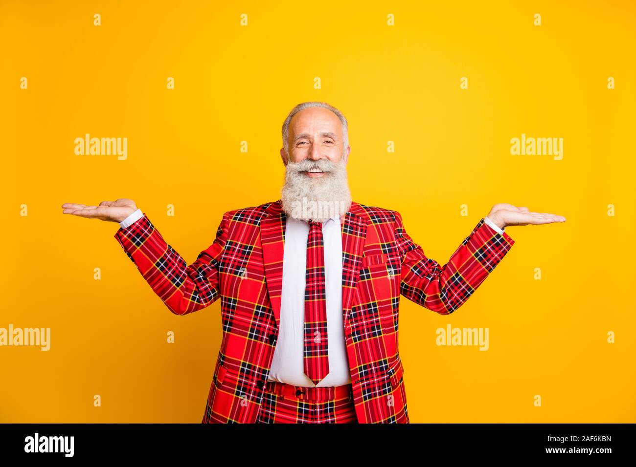 Photo of funny grandpa guy holding open palms empty space two novelty ...