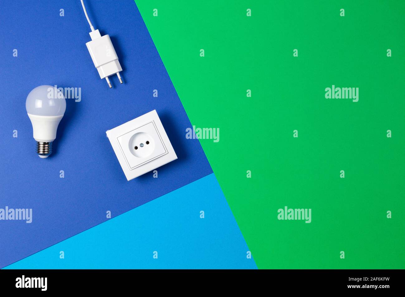 White electrical power socket, power plug, light lamp bulb on light ...